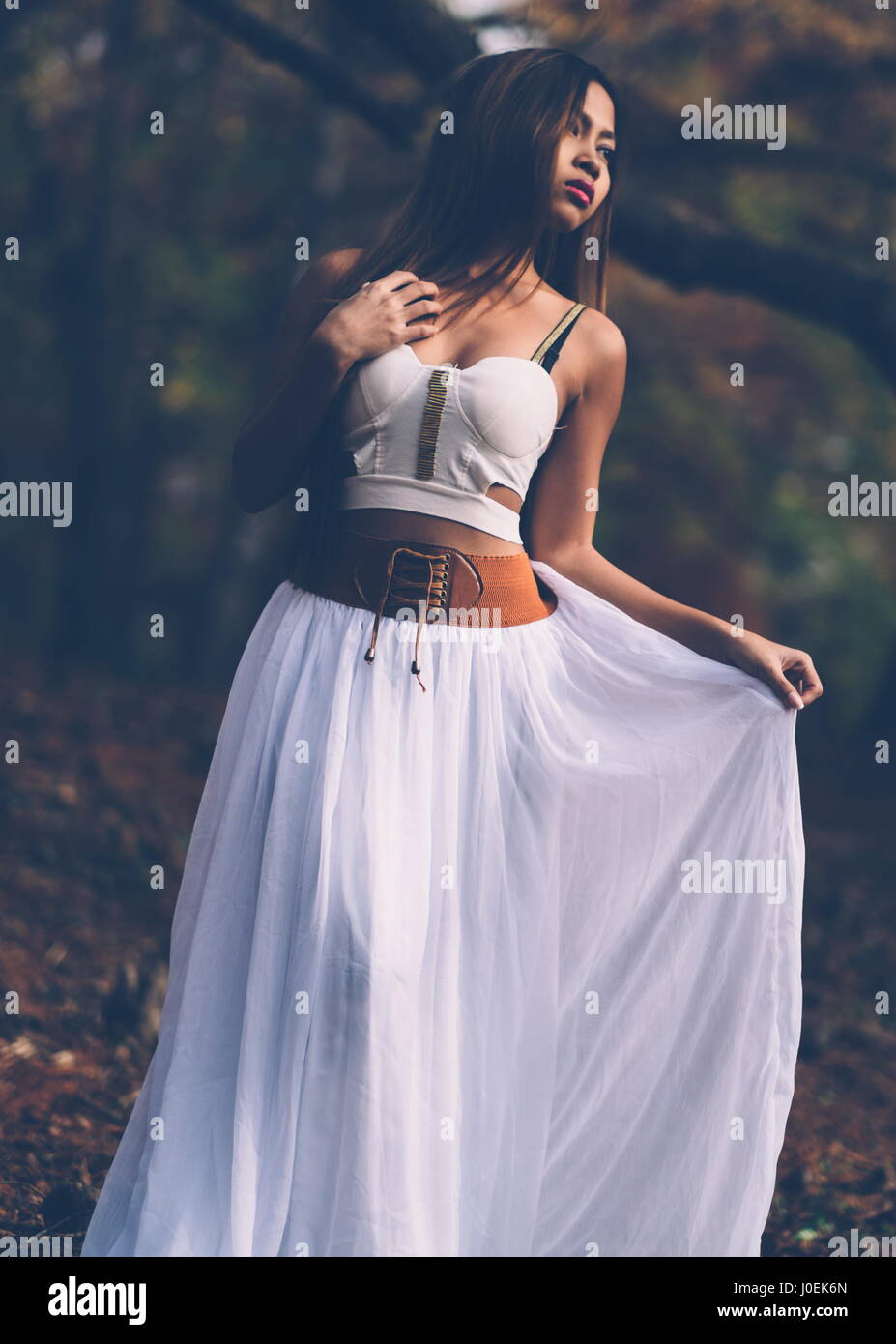 Beautiful wiccan girl dancing in the mystical forest Stock Photo - Alamy