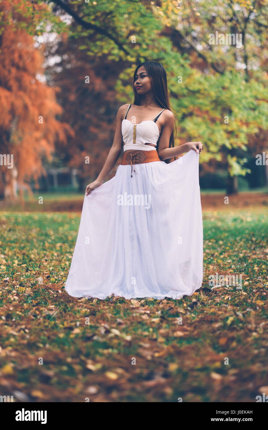 Beautiful wiccan girl dancing in the forest Stock Photo - Alamy