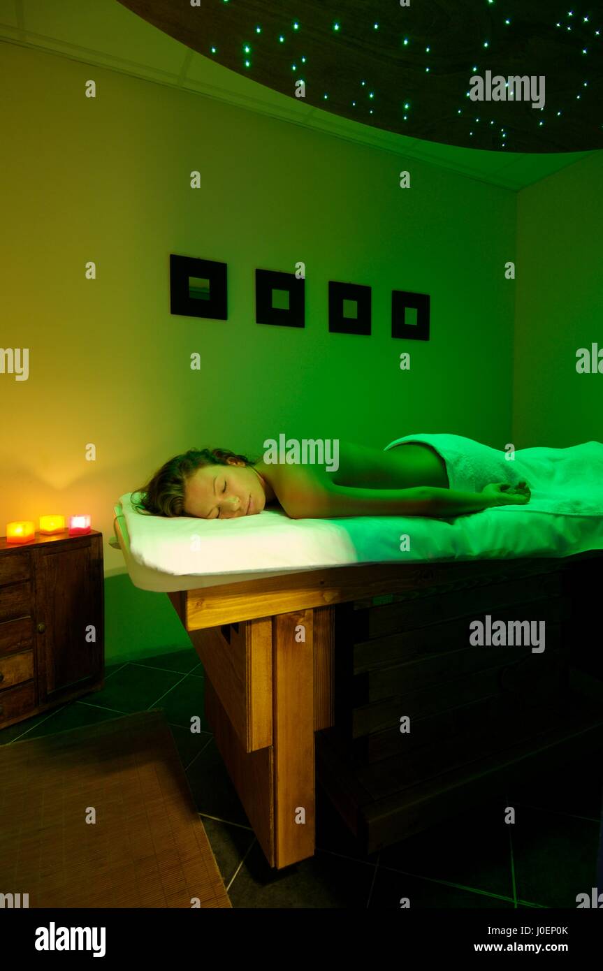 woman doing color therapy chromotherapy in spa room Stock Photo - Alamy