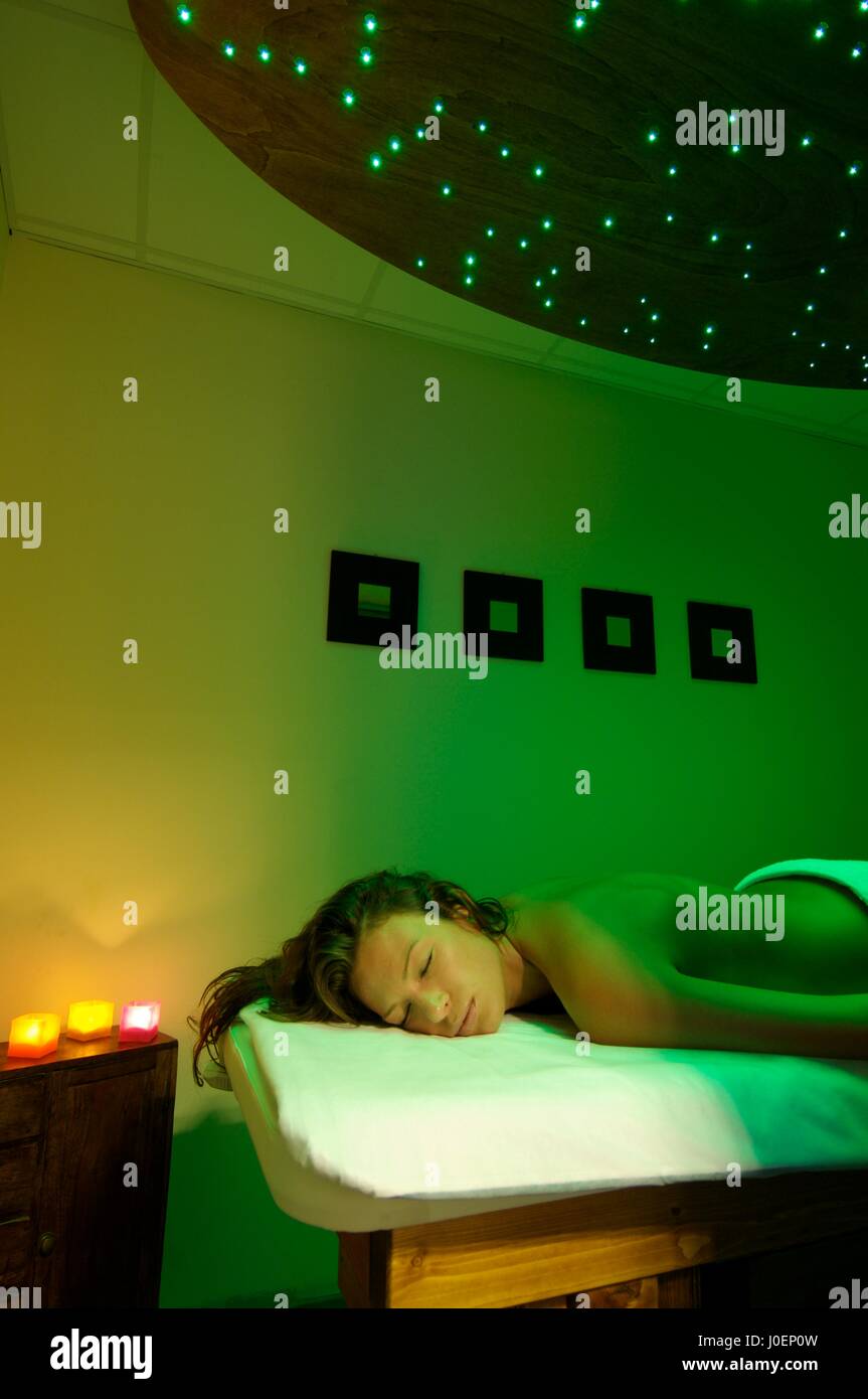 woman doing color therapy chromotherapy in spa room Stock Photo - Alamy