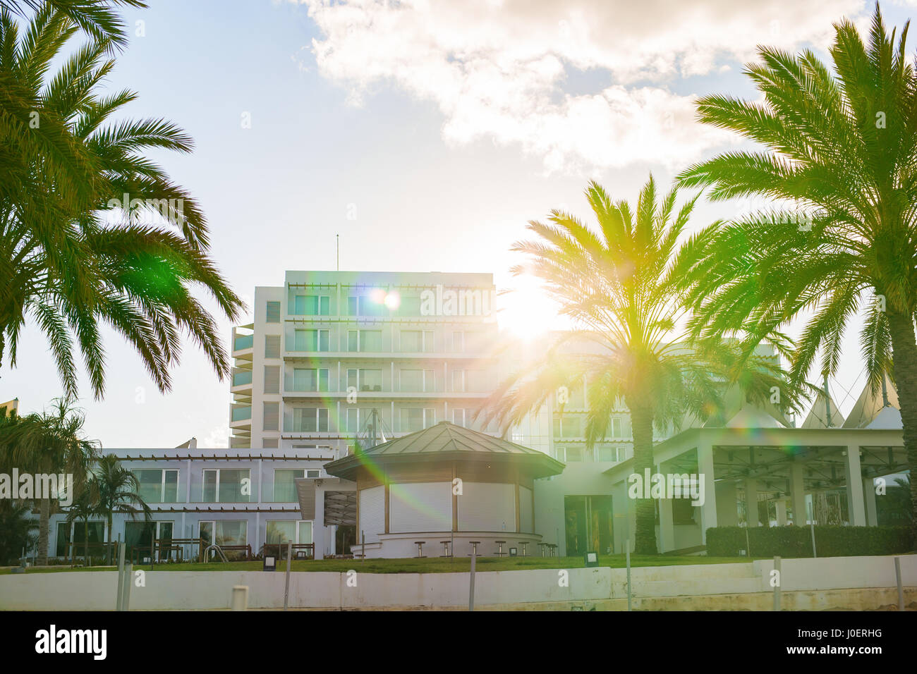Front view of a hotel in evening sun Stock Photo - Alamy