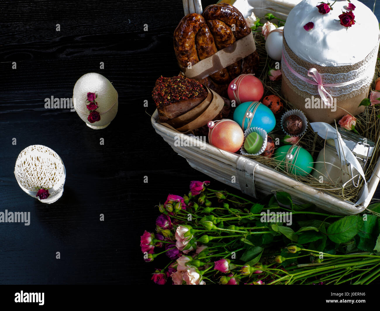 Easter basket for ceremony witn different food: Easter cake, dyeed eggs ...