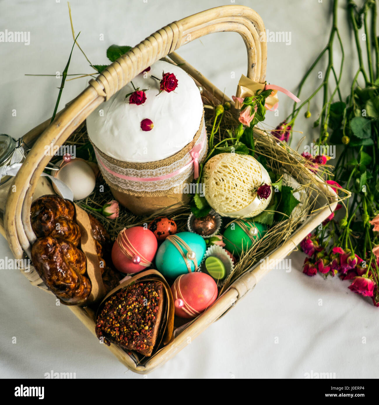 Easter basket for ceremony witn different food: Easter cake, colored ...