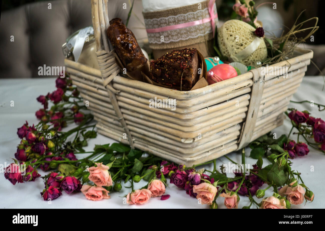 Easter basket for ceremony witn different food: Easter cake, colored ...