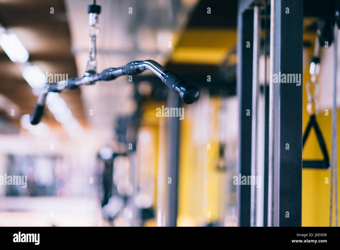 Fitness gym, detail of the lot machine, pull down bar Stock Photo - Alamy
