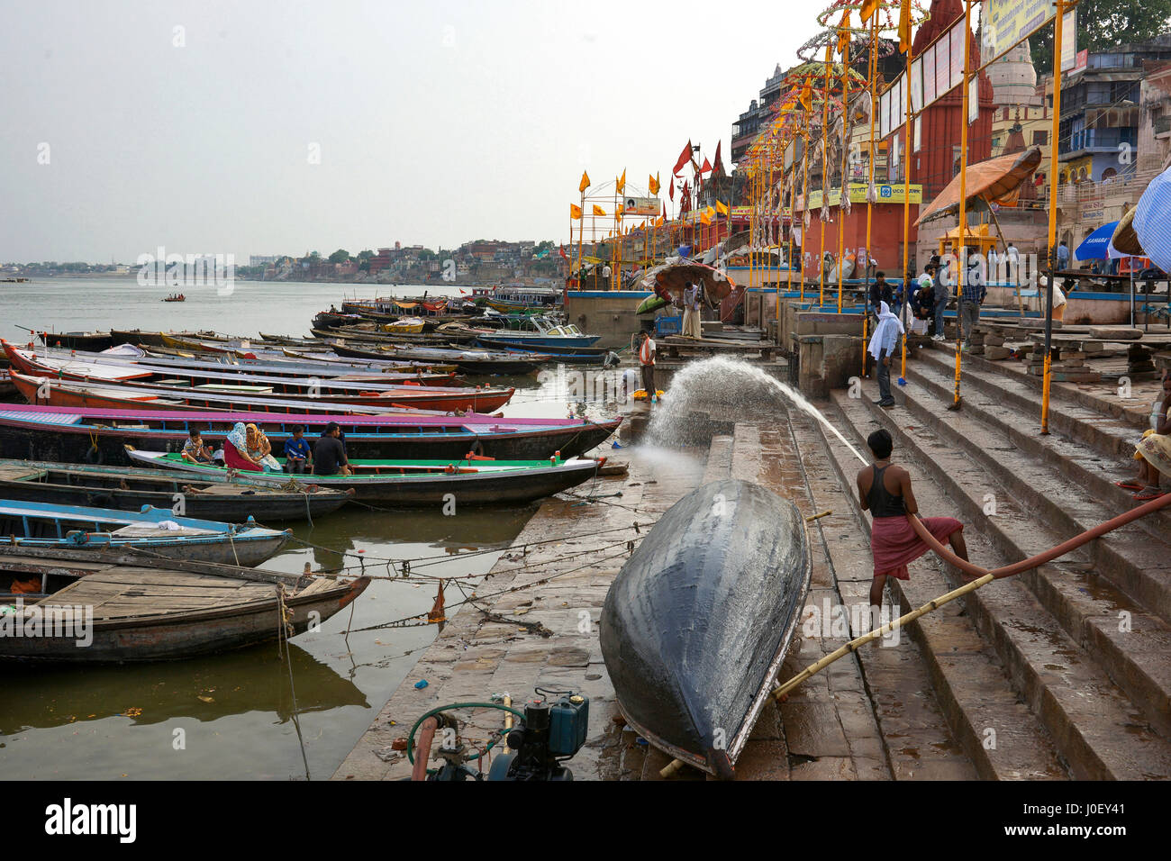 Man cleaning ghat varanasi uttar pradesh india hi-res stock photography ...