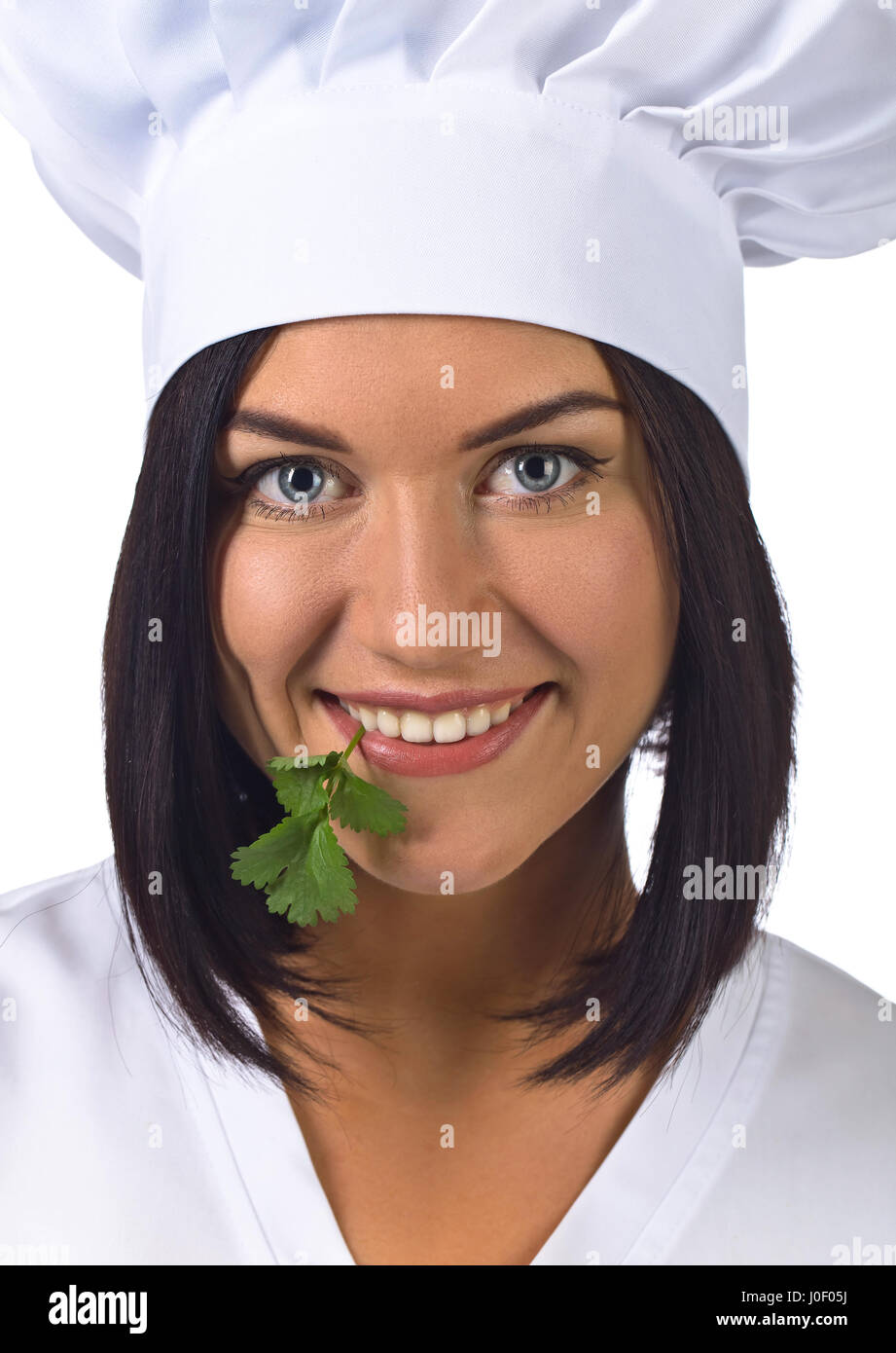 Beauty Brunette Woman in chef uniform with parsley . Beautiful ...