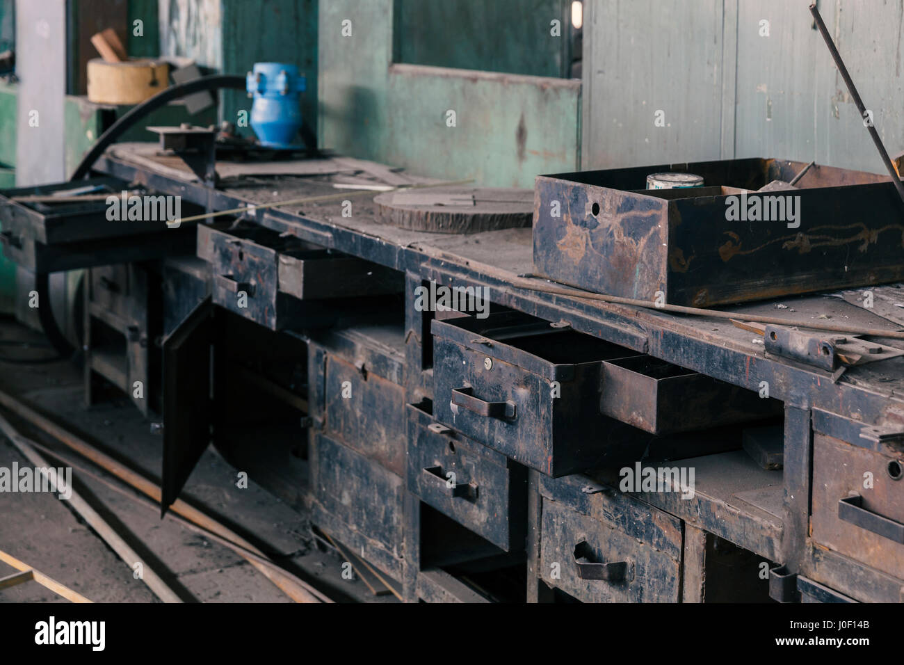 old metal desk with shelfs in the mechanical workshop Stock Photo - Alamy