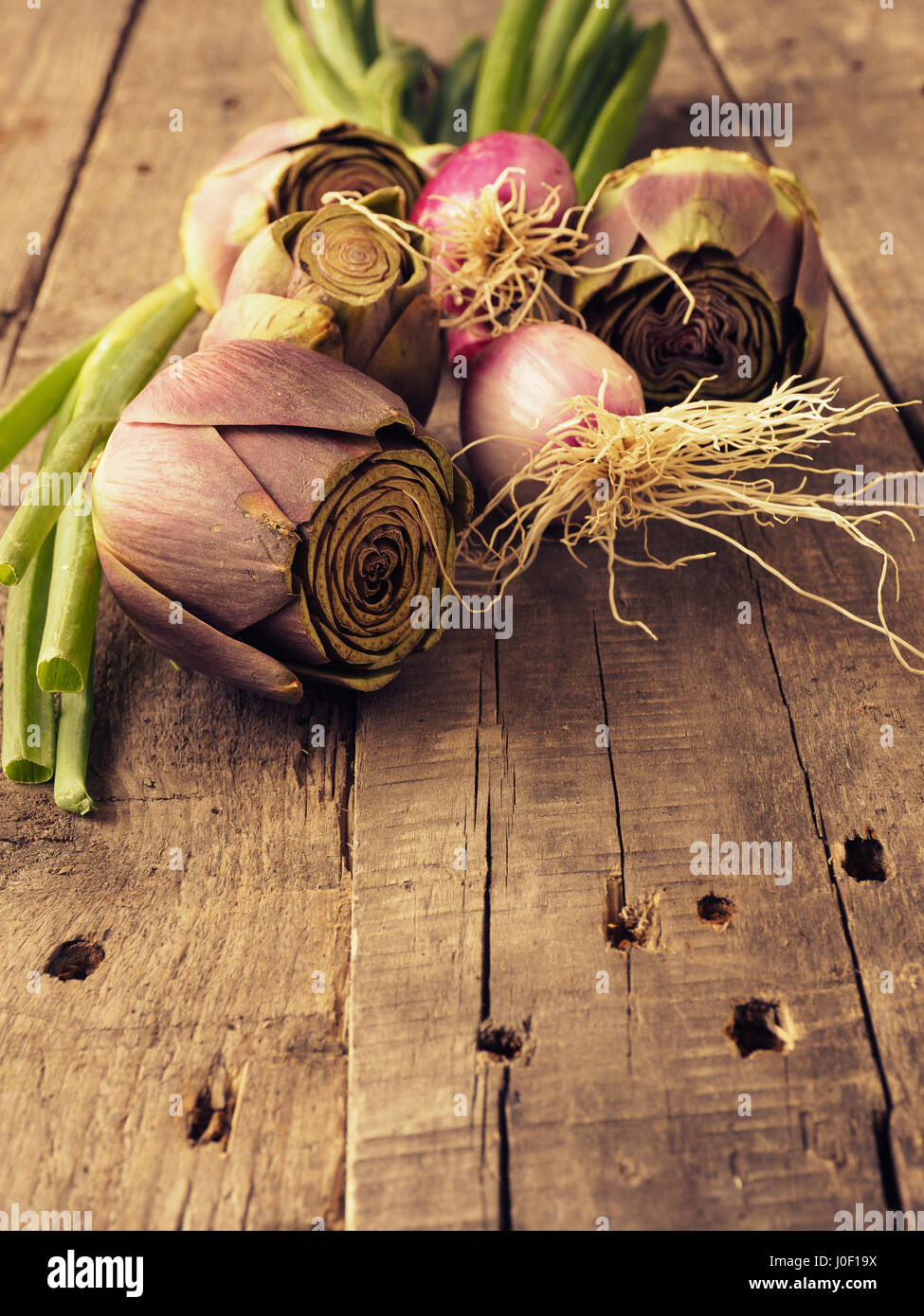 Healthy food concept with organic vegetables on a rustic wooden table ...