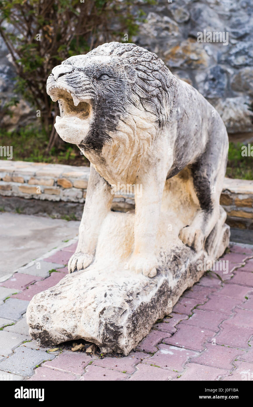 Stone lion statue Stock Photo - Alamy