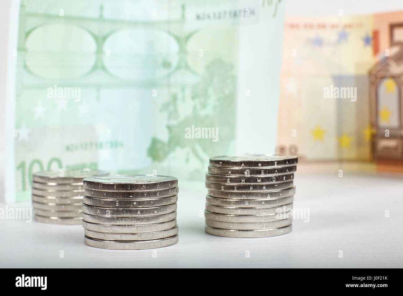 Euro coins stacks and banknotes as background Stock Photo - Alamy