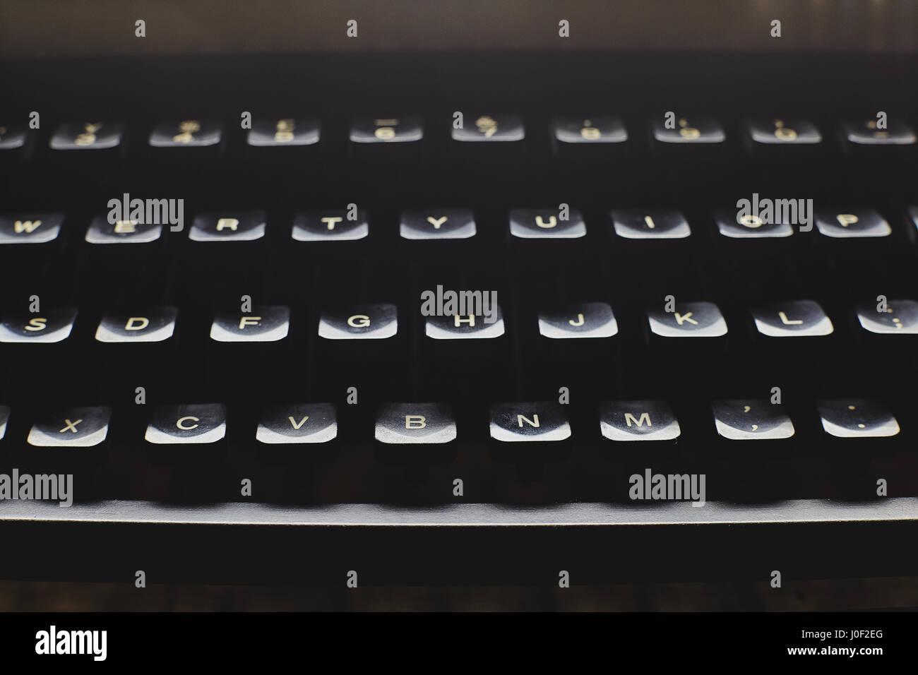 Detail of a black vintage typewriter close up on keys Stock Photo - Alamy
