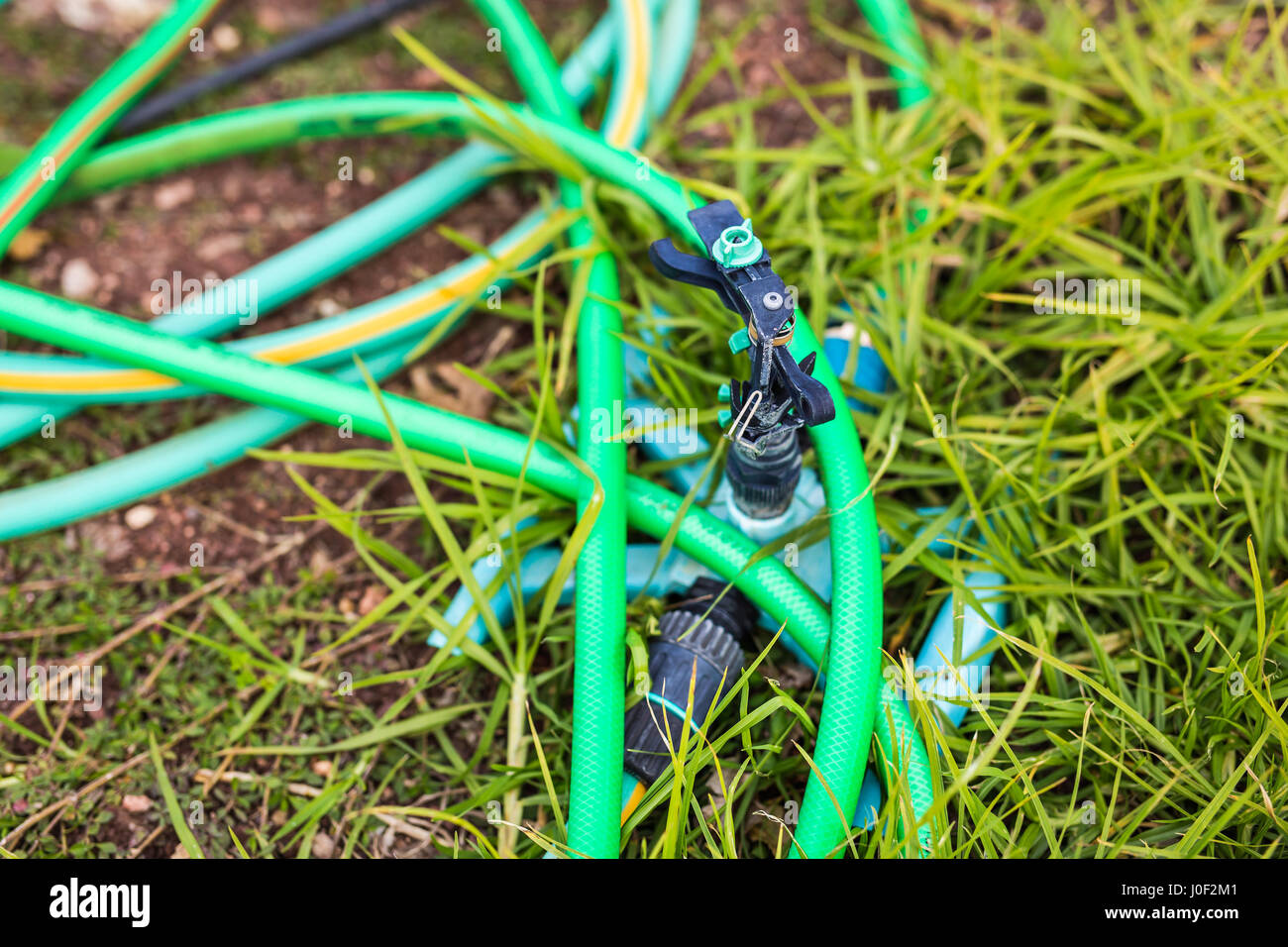 Garden hose-pipe outdoor Stock Photo - Alamy