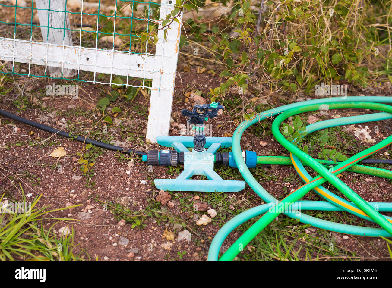 Garden hose-pipe outdoor Stock Photo - Alamy