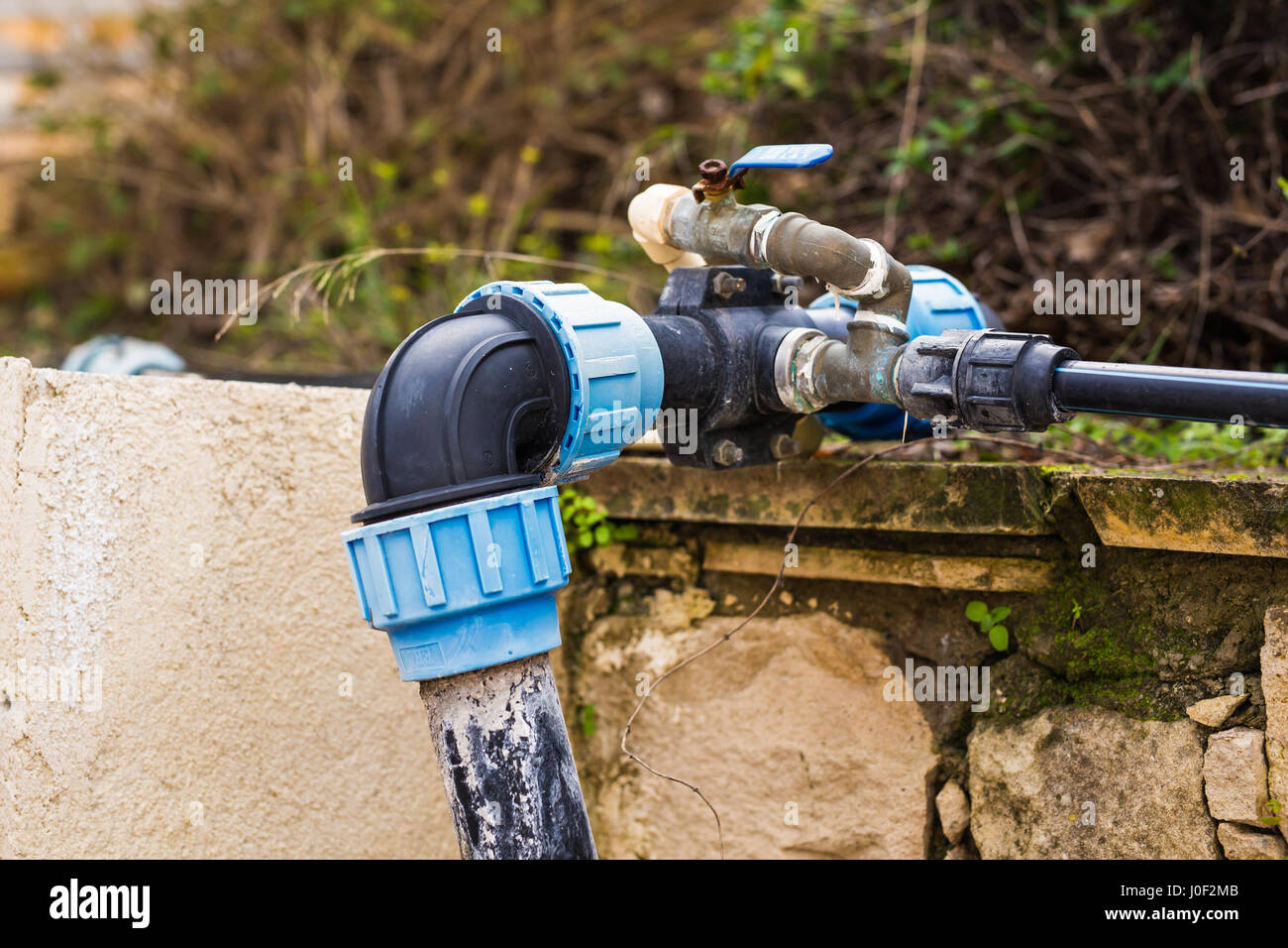 Garden hose-pipe outdoor Stock Photo - Alamy