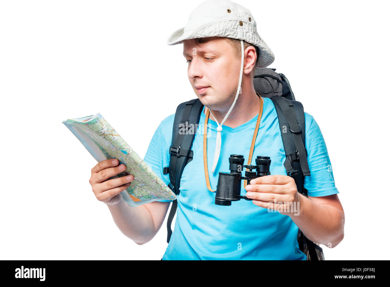 Horizontal portrait of a lost tourist looking at a map isolated Stock ...