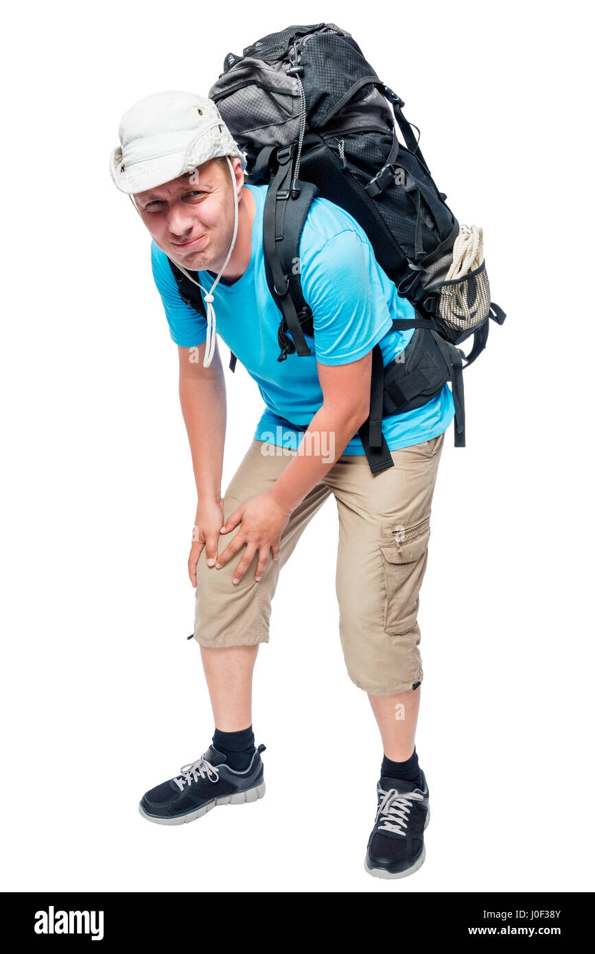 Portrait of a tourist man with a sick knee against a white background ...