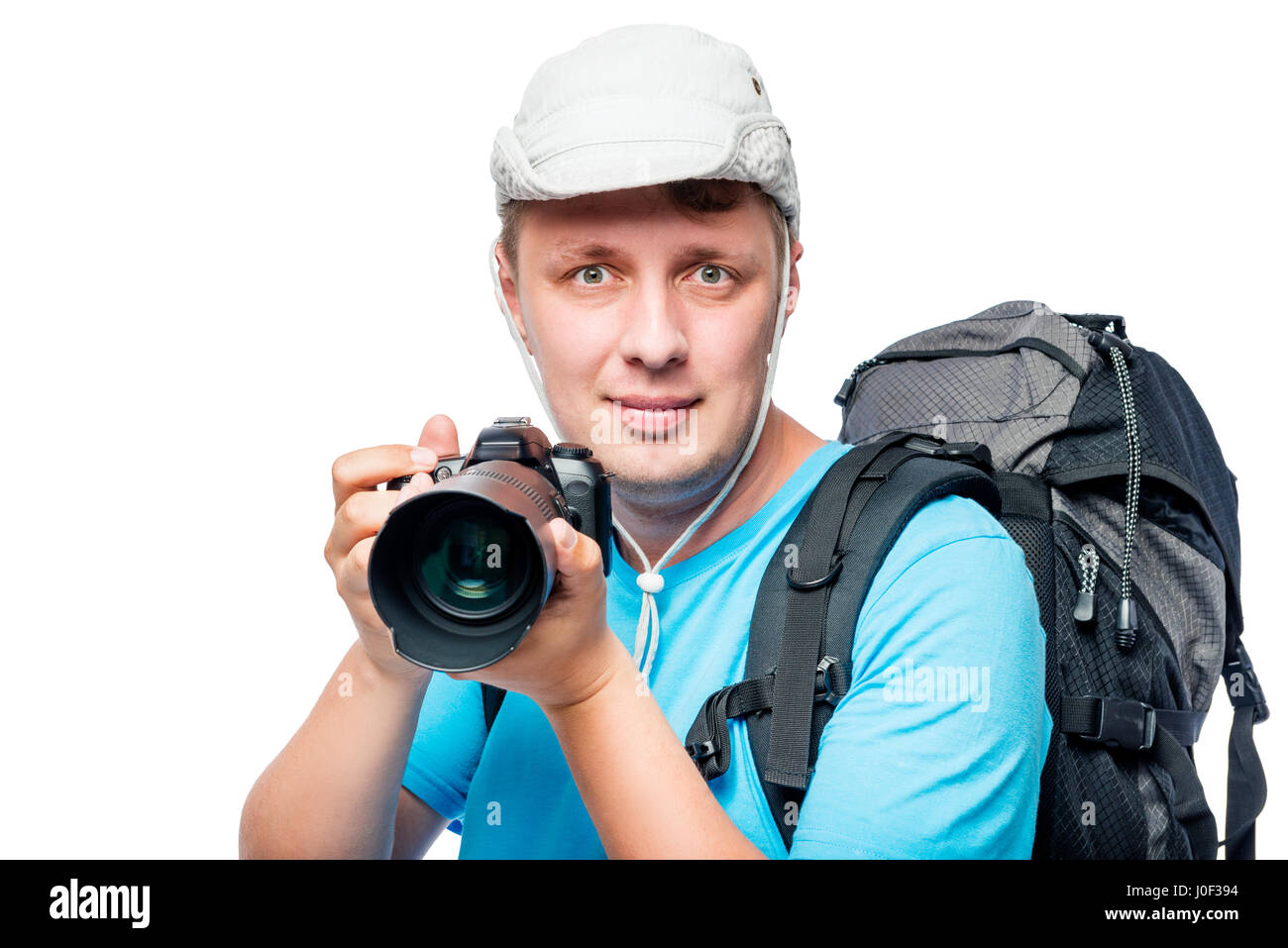 Horizontal portrait of a photographer with a camera in hands on a white ...