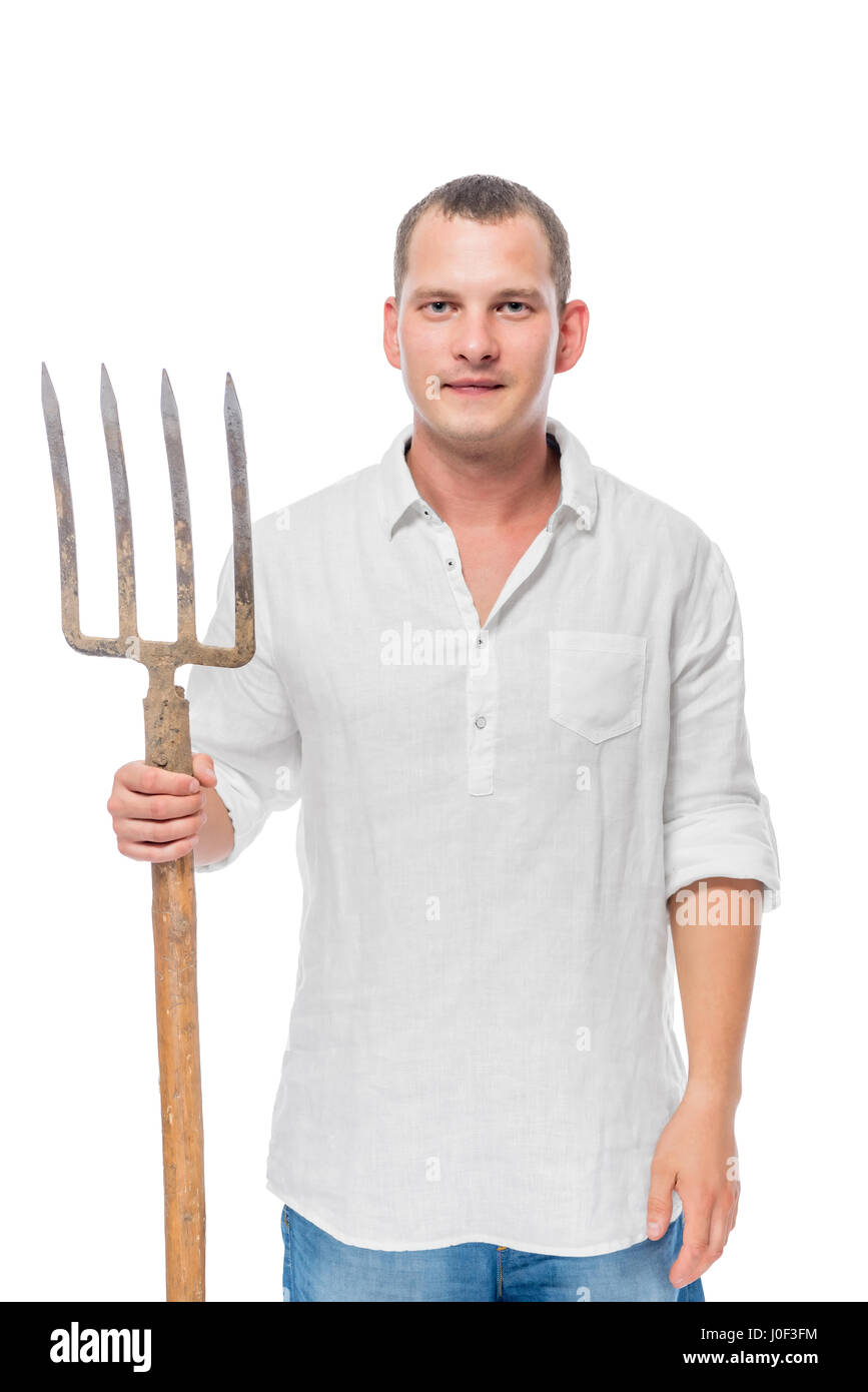 Vertical portrait of a farmer with forks in his hand on a white ...