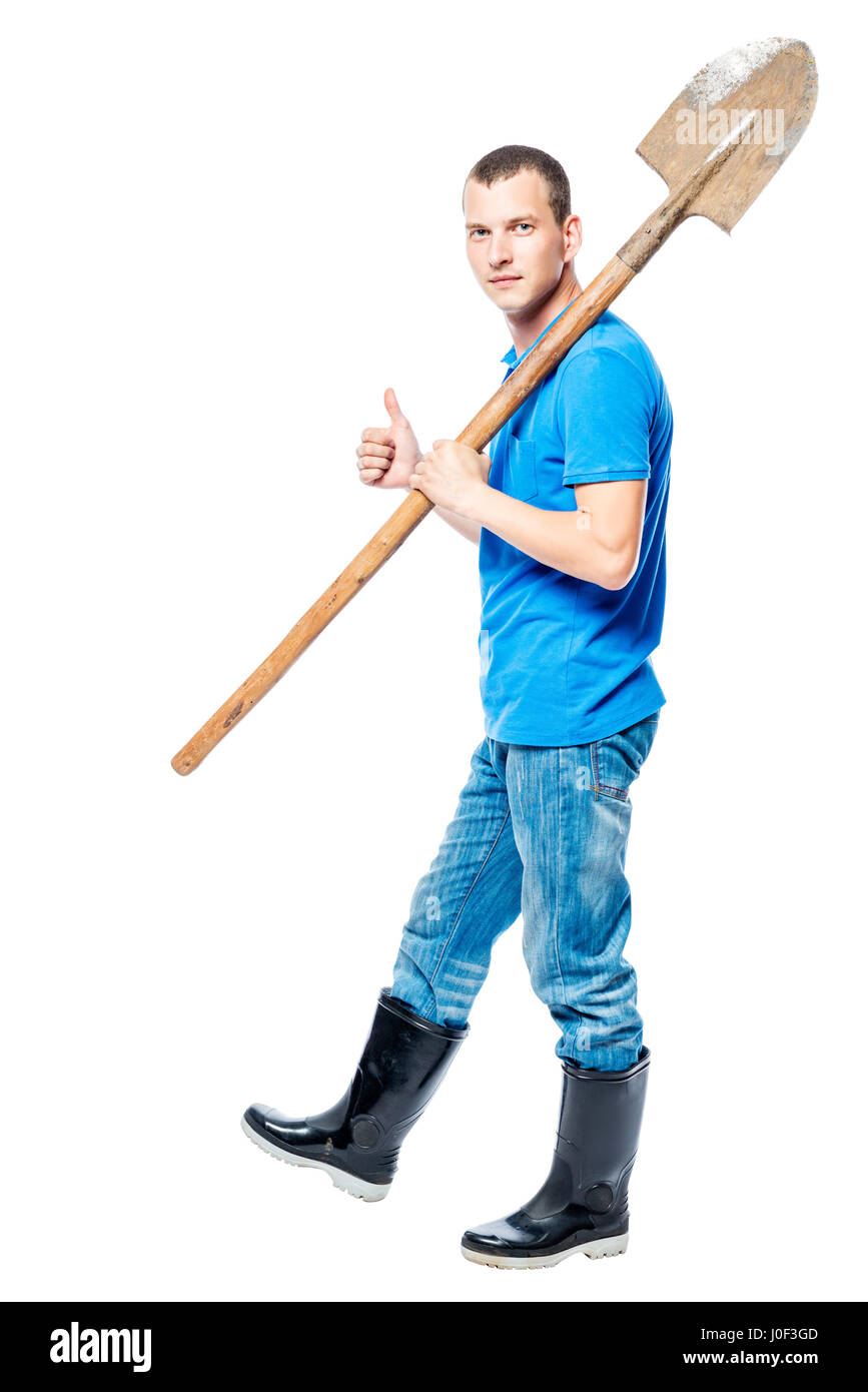 Working man with a shovel goes to dig on a white background Stock Photo ...