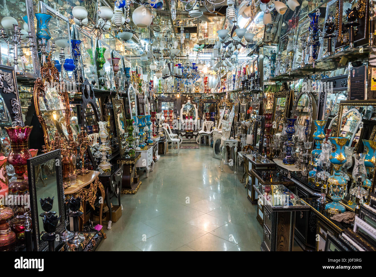 Shop with mirrors and lamps for sale on the old Bazaar of Kashan city ...