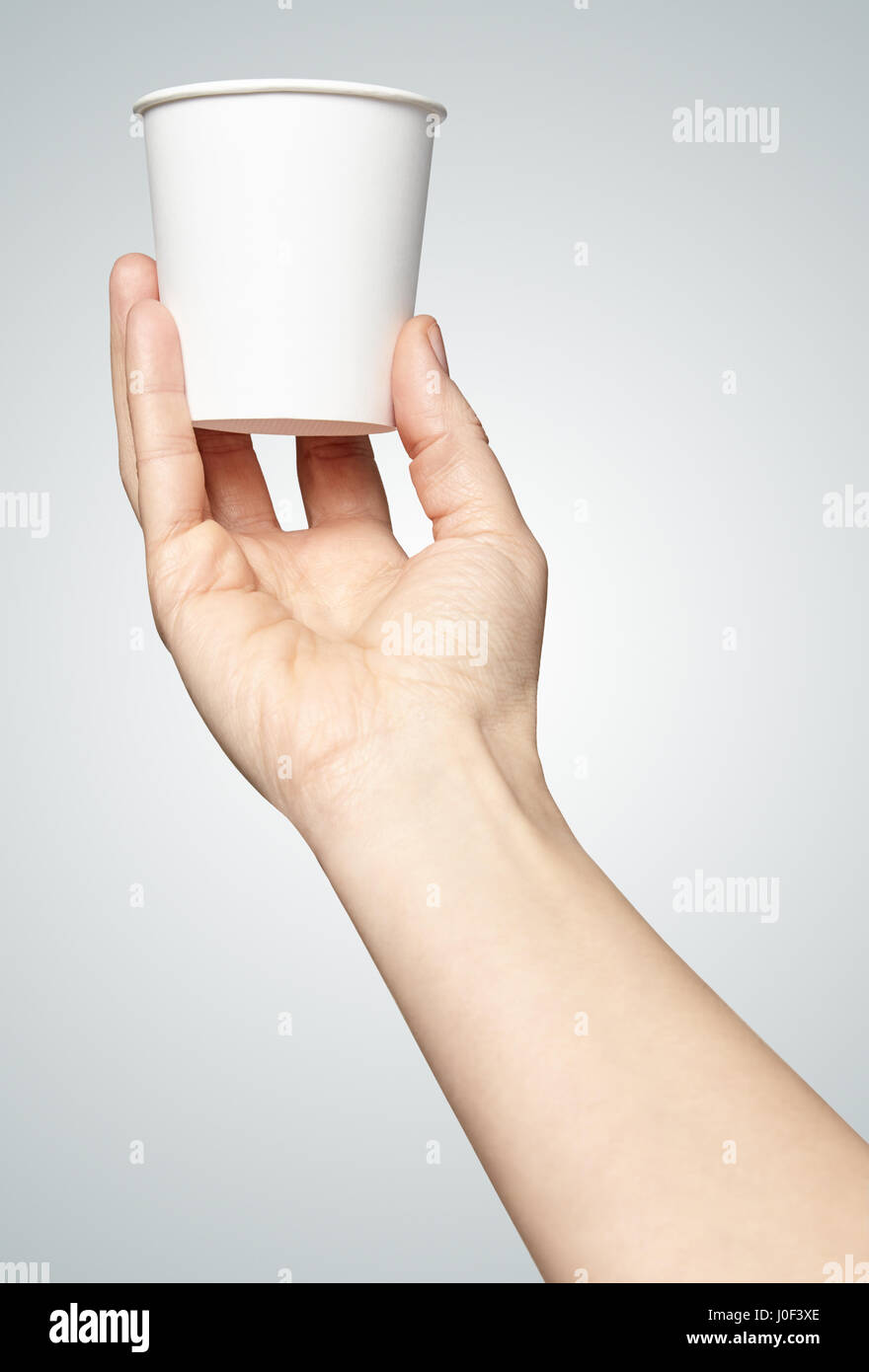 Woman hand holding a cup Stock Photo - Alamy