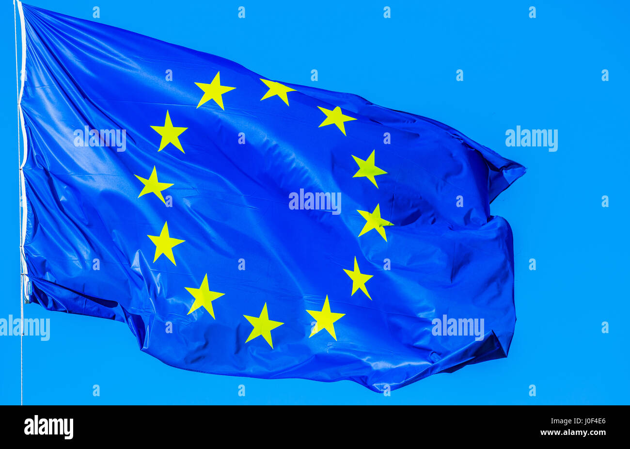 blue Europe flag waving in the wind on blue sky Stock Photo - Alamy
