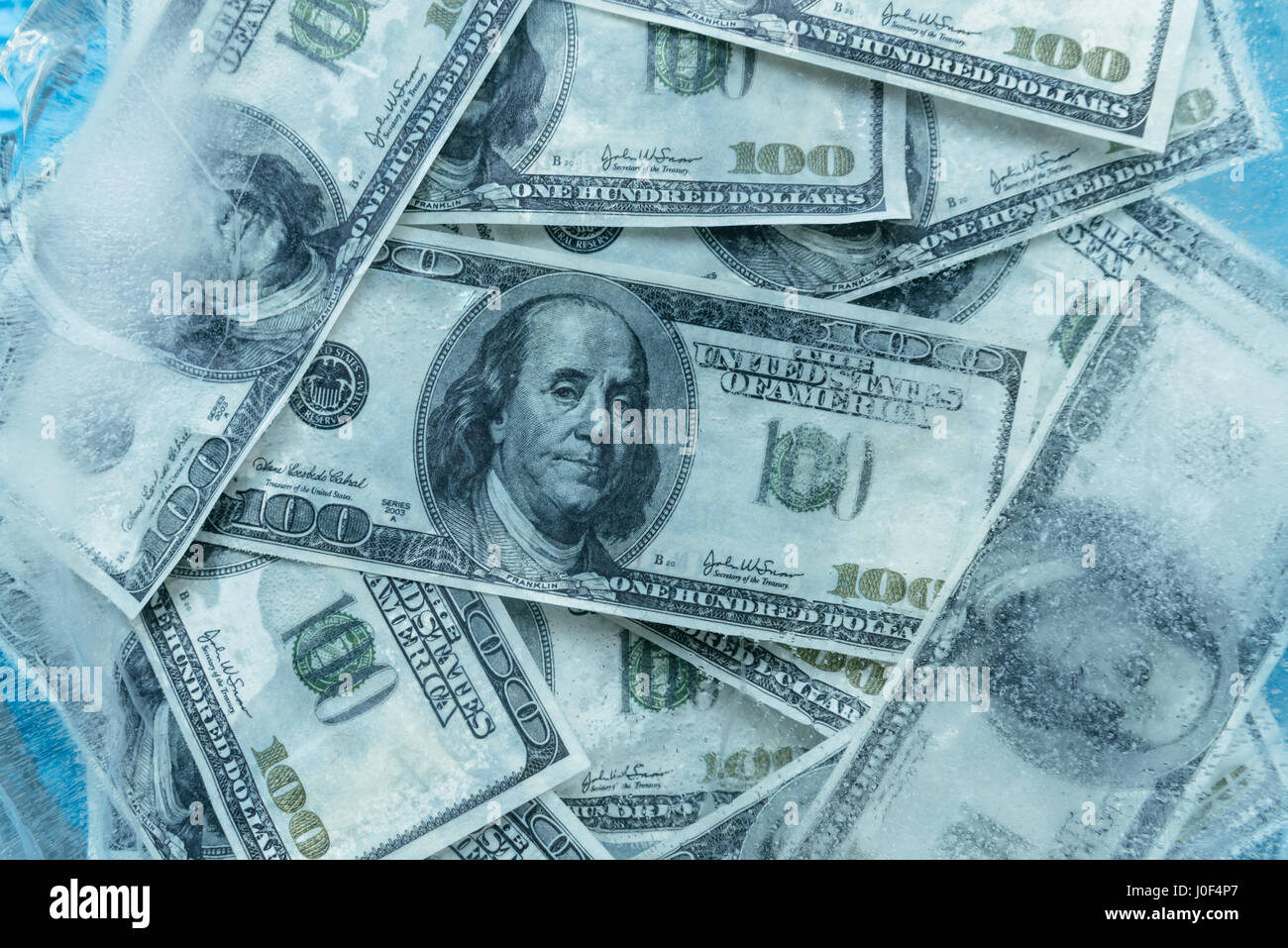 Ice cube dollar bill hi-res stock photography and images - Alamy