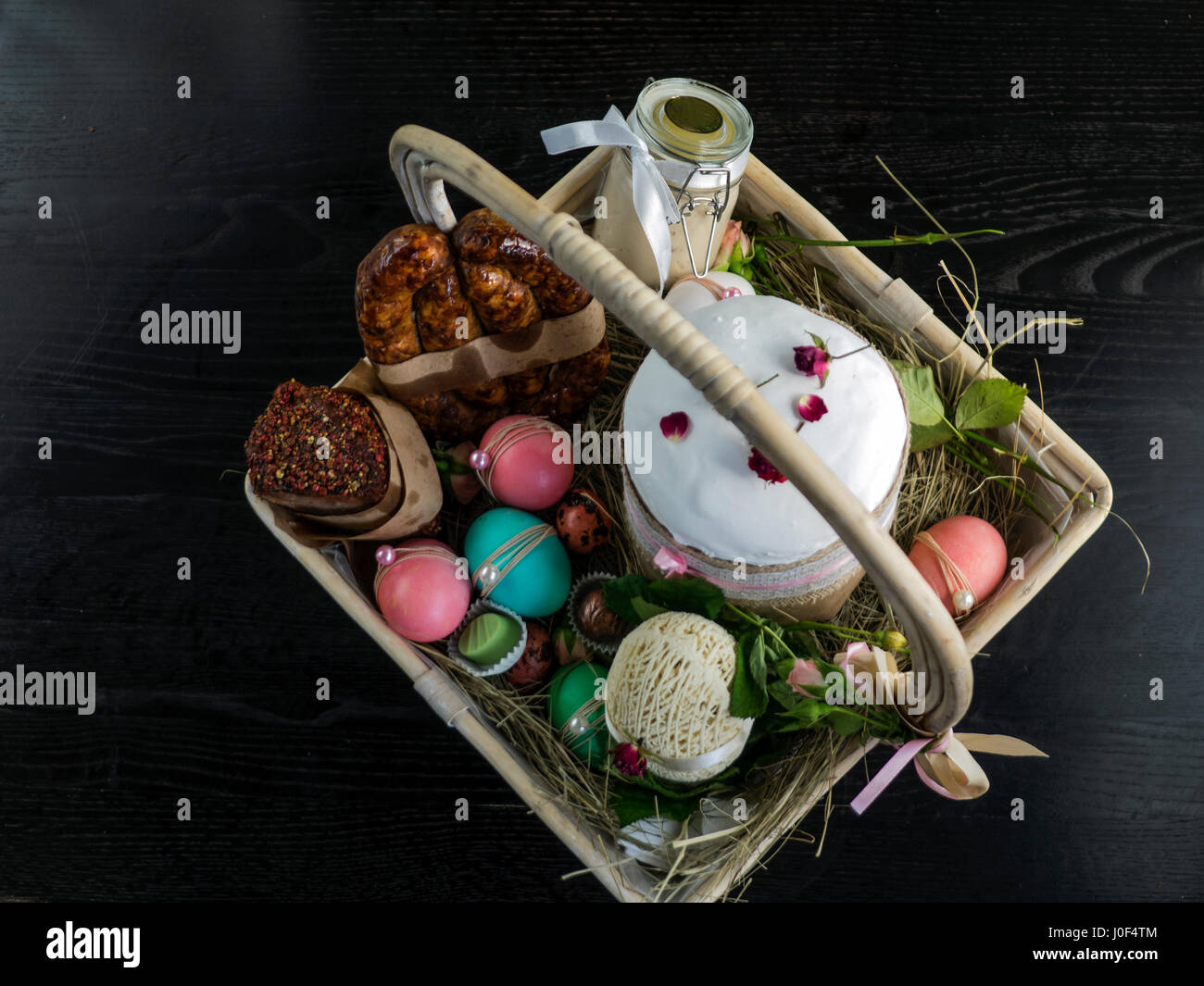 Easter basket for ceremony witn different food: Easter cake, colored ...