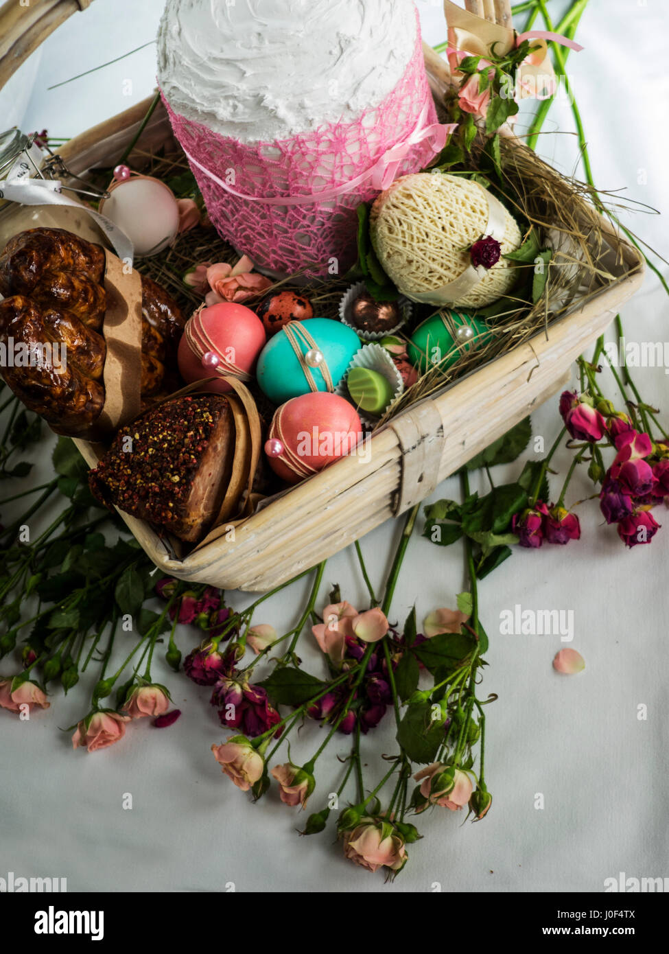 Easter basket for ceremony witn different food: Easter cake, colored ...