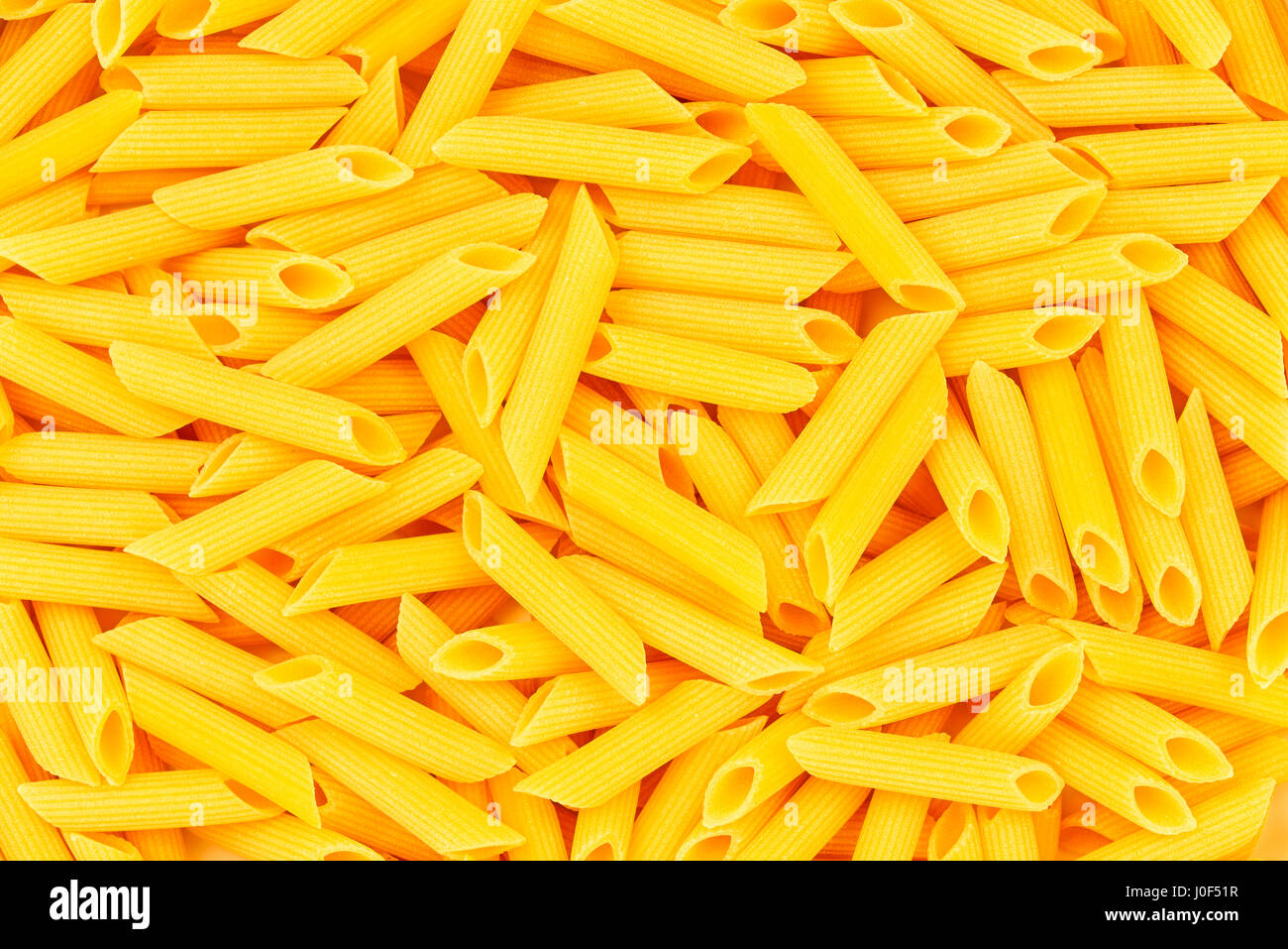 Italian Penne Rigate Macaroni Pasta raw food background or texture ...