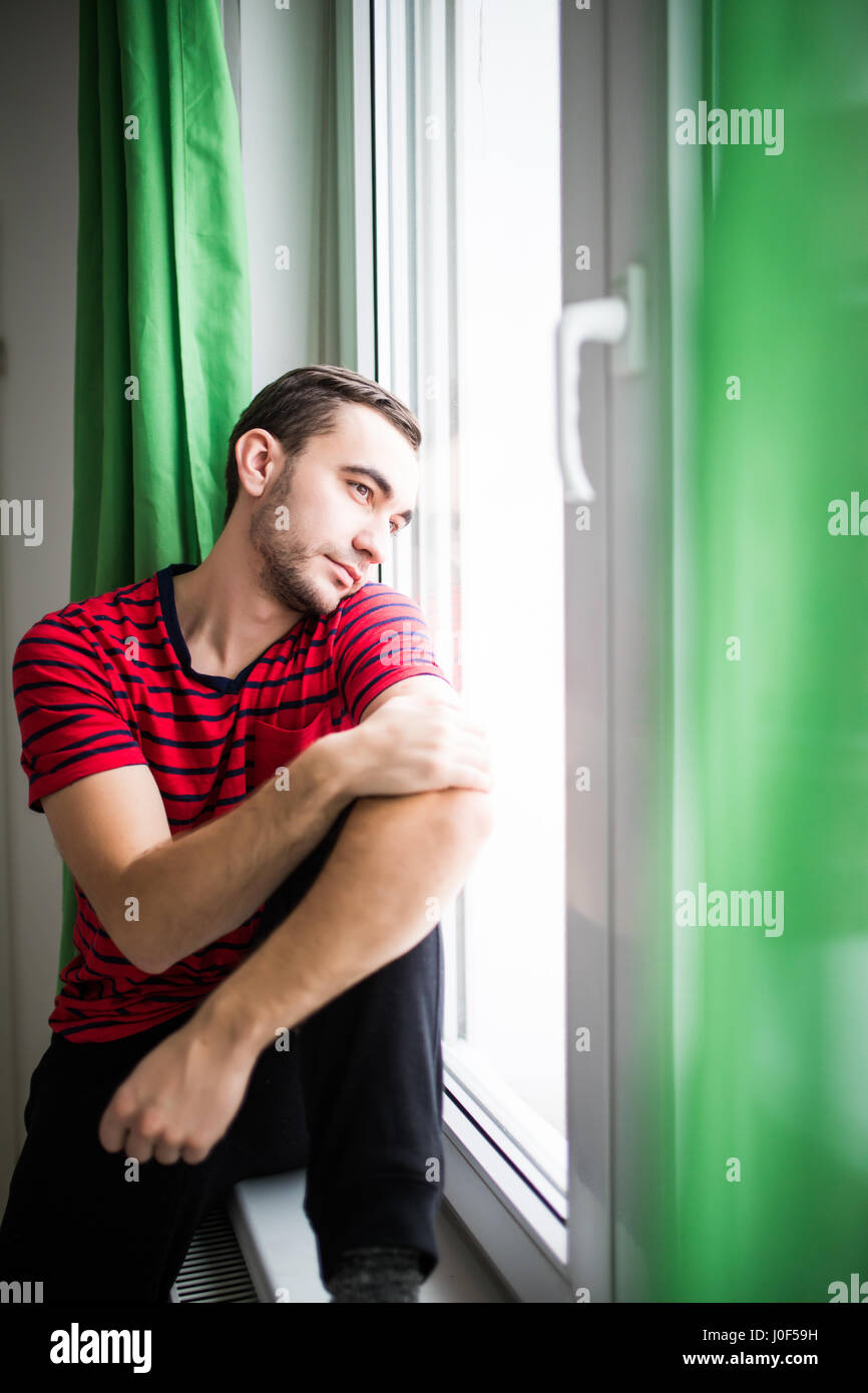 man standing by the window in the morning Stock Photo - Alamy