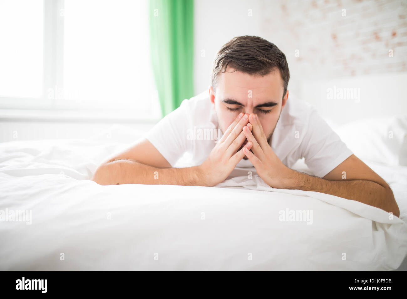 Sleeping man wake up in the morning with insomnia Stock Photo - Alamy