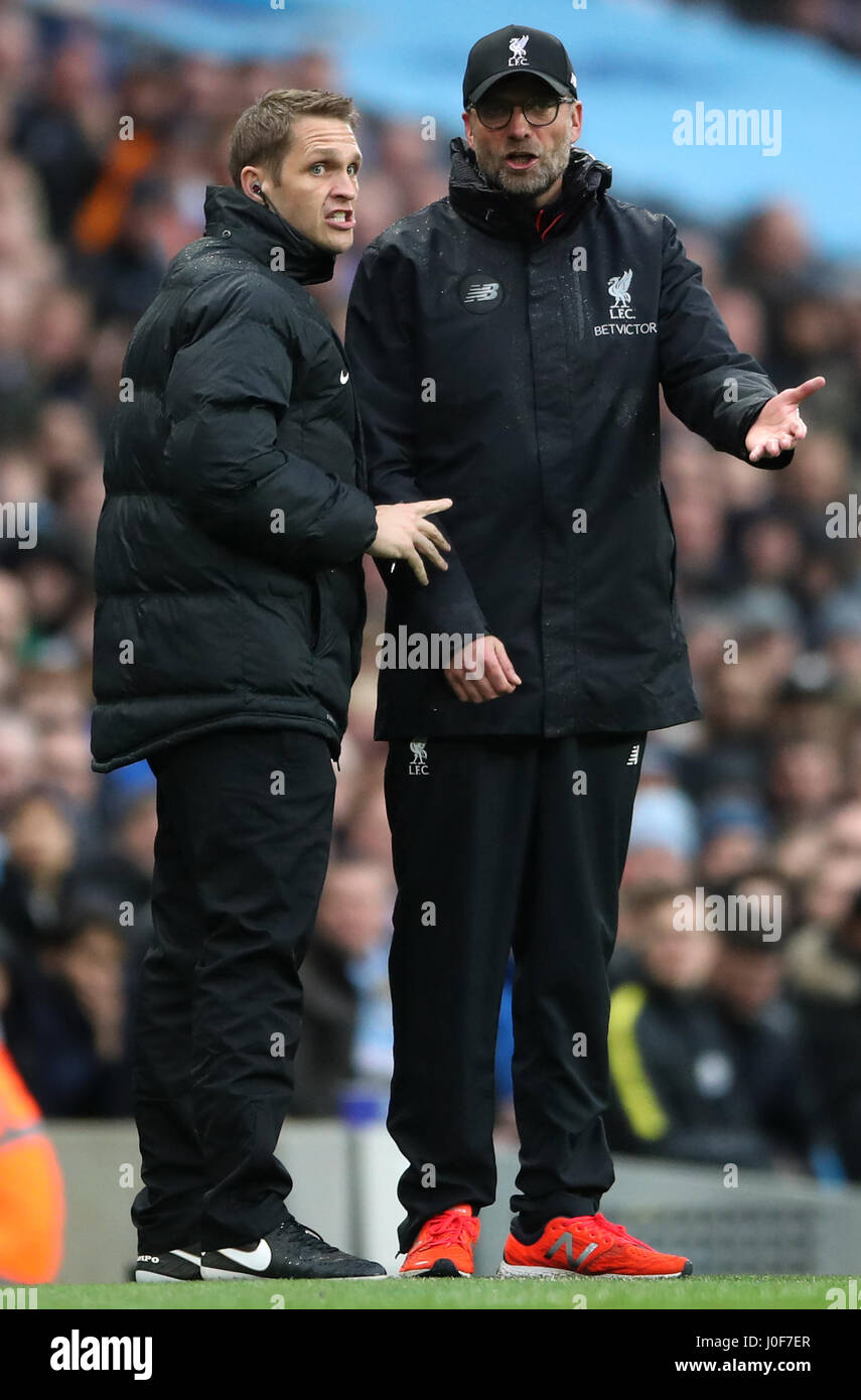Liverpool manager Jurgen Klopp (right) argues his point to fourth ...