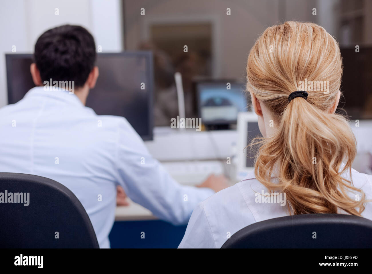 Serious hard working doctors concentrating on their work Stock Photo ...