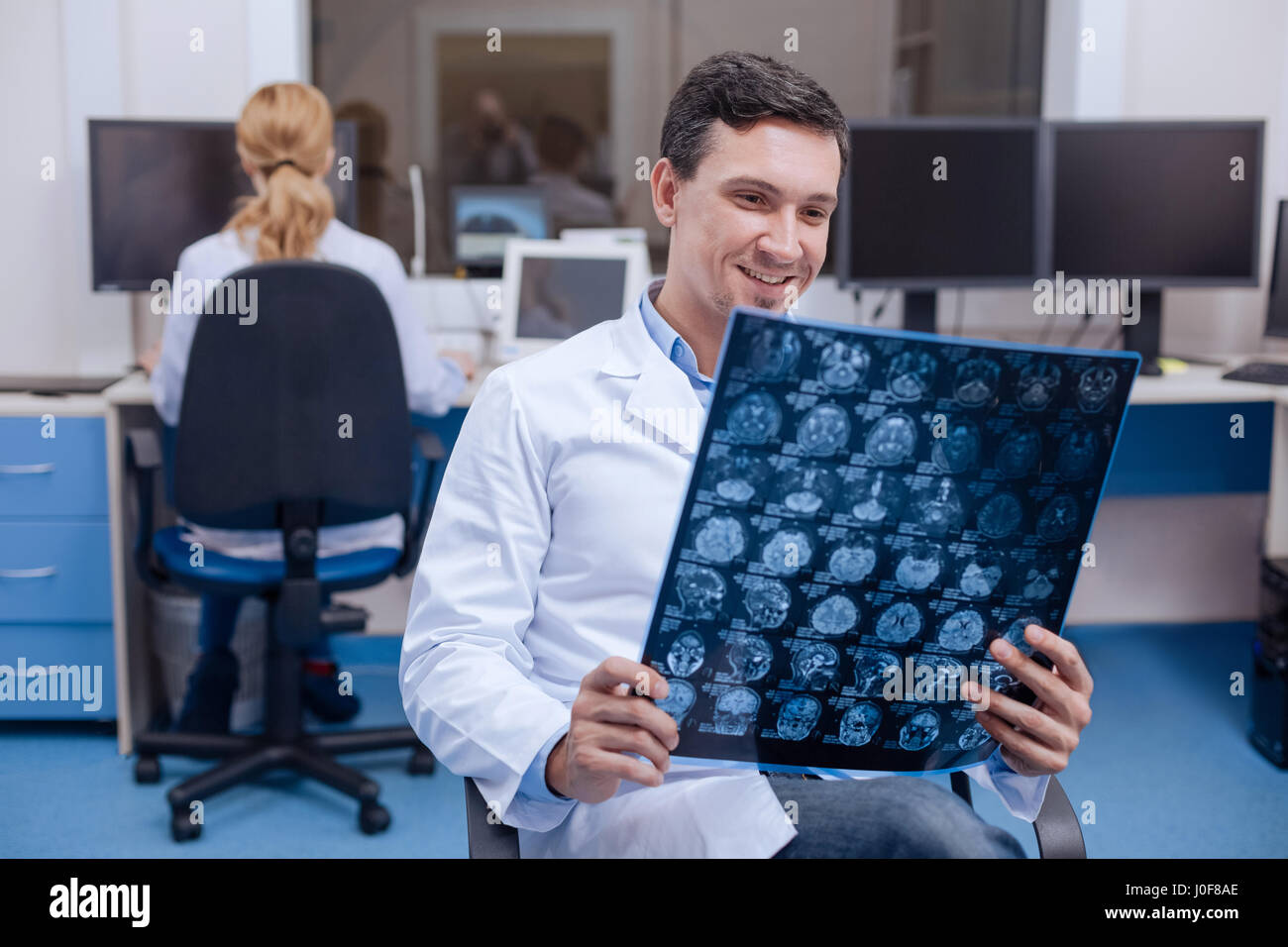 Cheerful happy doctor noticing the improvement Stock Photo - Alamy