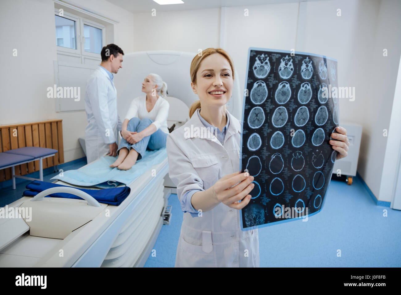 Positive happy doctor working in the CT lab Stock Photo - Alamy