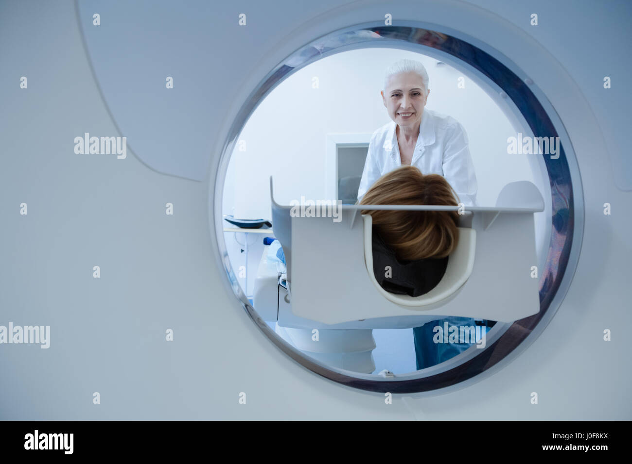 Positive experienced doctor starting diagnostics Stock Photo - Alamy