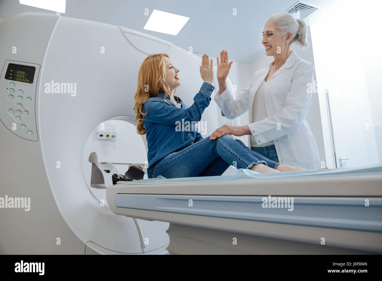 Cheerful positive women giving high five Stock Photo - Alamy