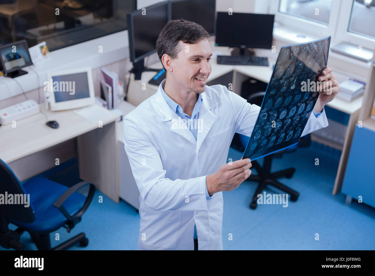 Positive happy doctor smiling Stock Photo - Alamy