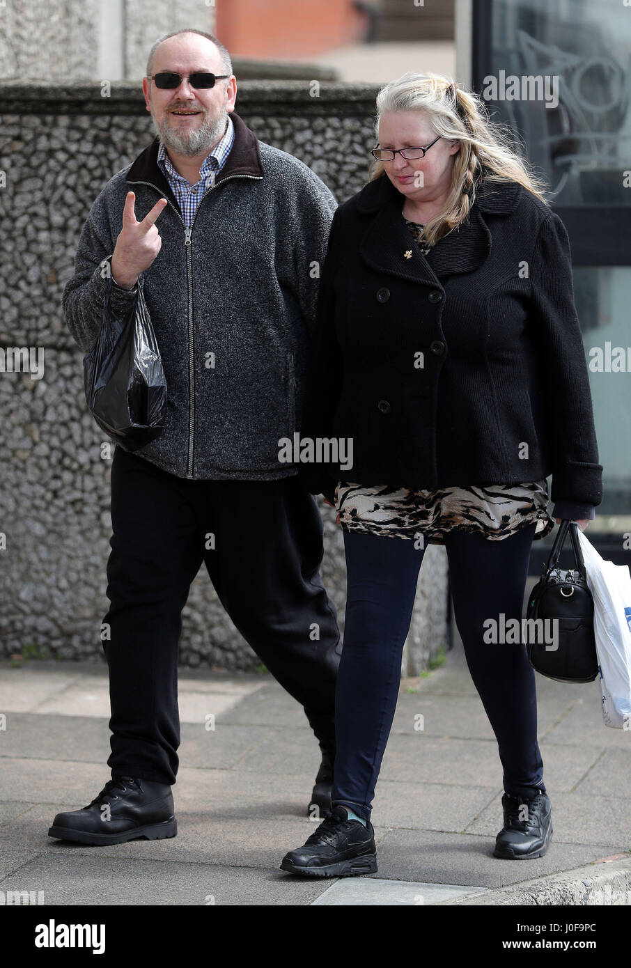 NOTE GESTURE Mark Sands (left) arrives at Brighton Magistrates Court ...