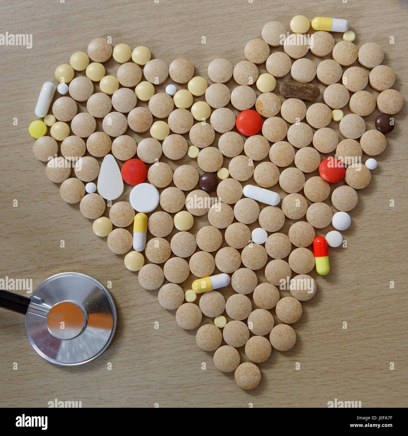 Colorful drug pills in shape of heart/pharmaceutical concept/Top view ...