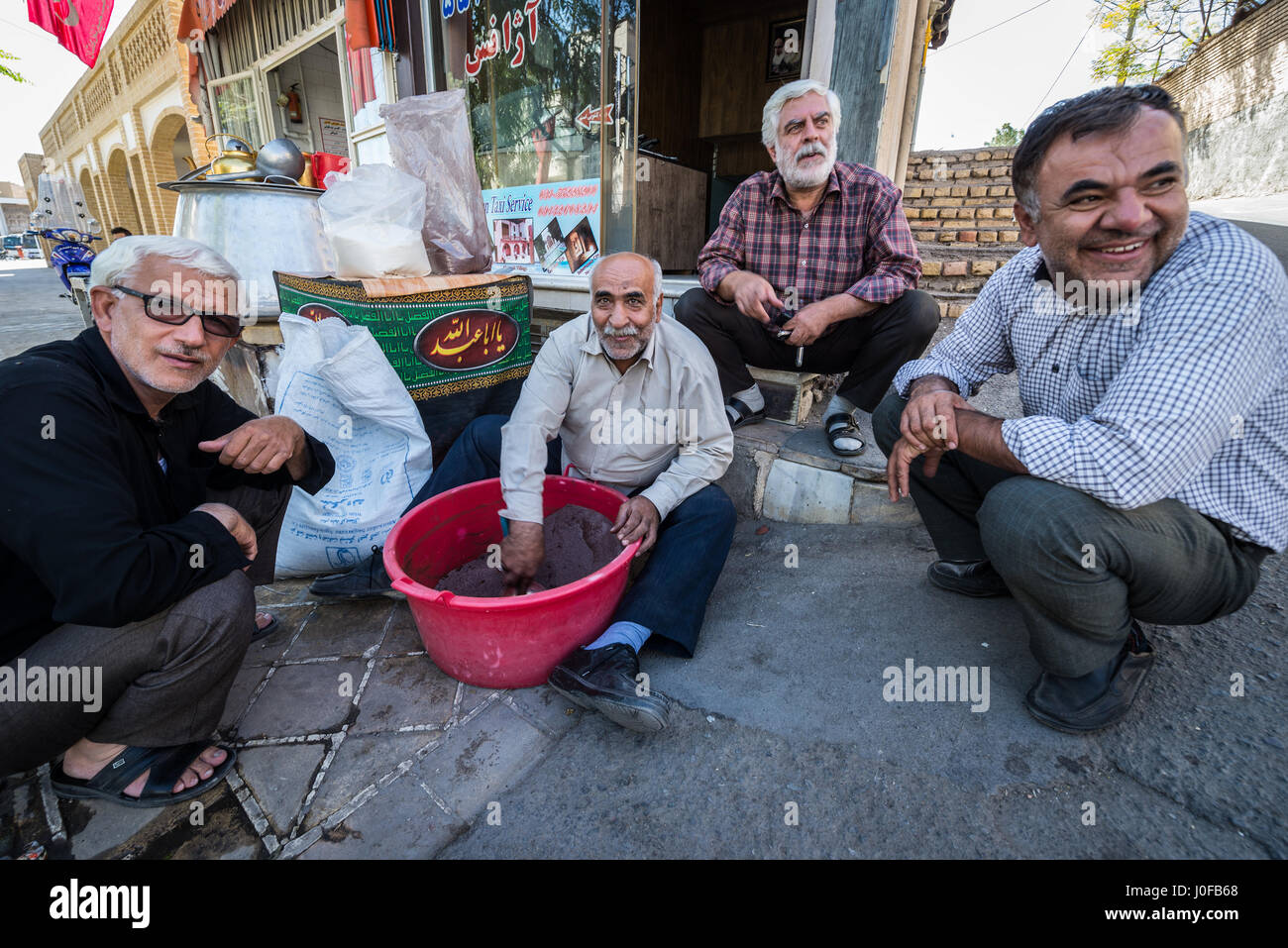 Iranian men posing for photo in front of shop in Kashan city, capital ...