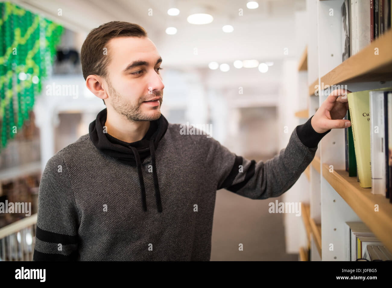 College library male student searching hi-res stock photography and ...
