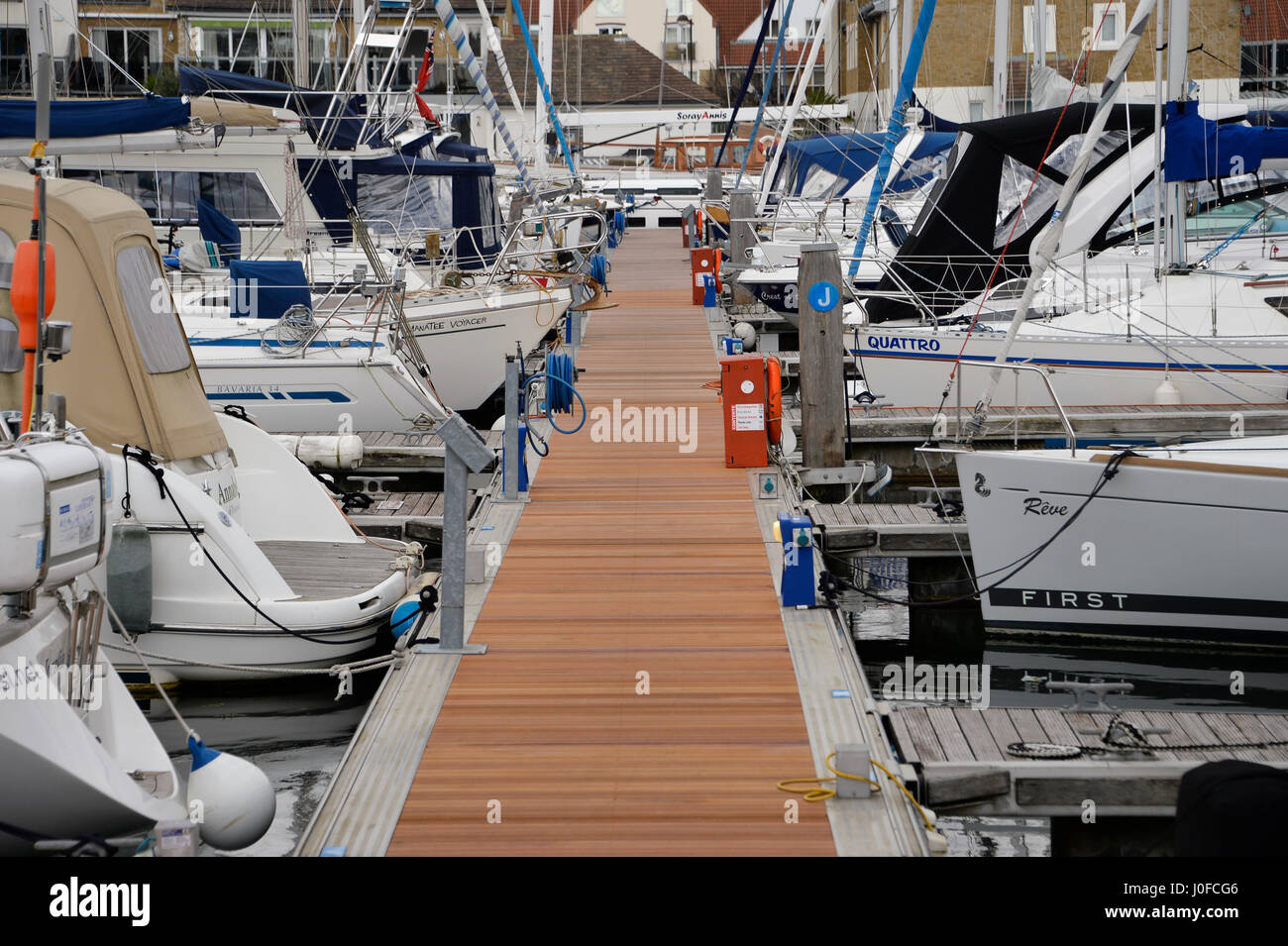marina pontoon with moored yachts Stock Photo - Alamy