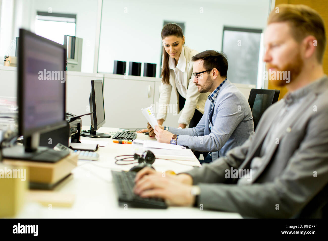 Young developers working in a modern office Stock Photo - Alamy