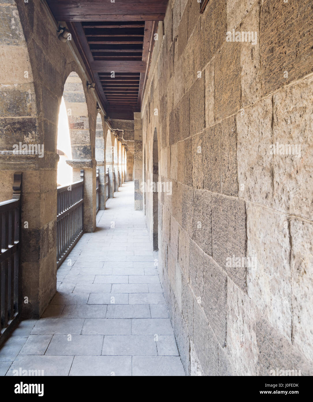 Angled view of one arch with interleaved wooden balustrades at the ...