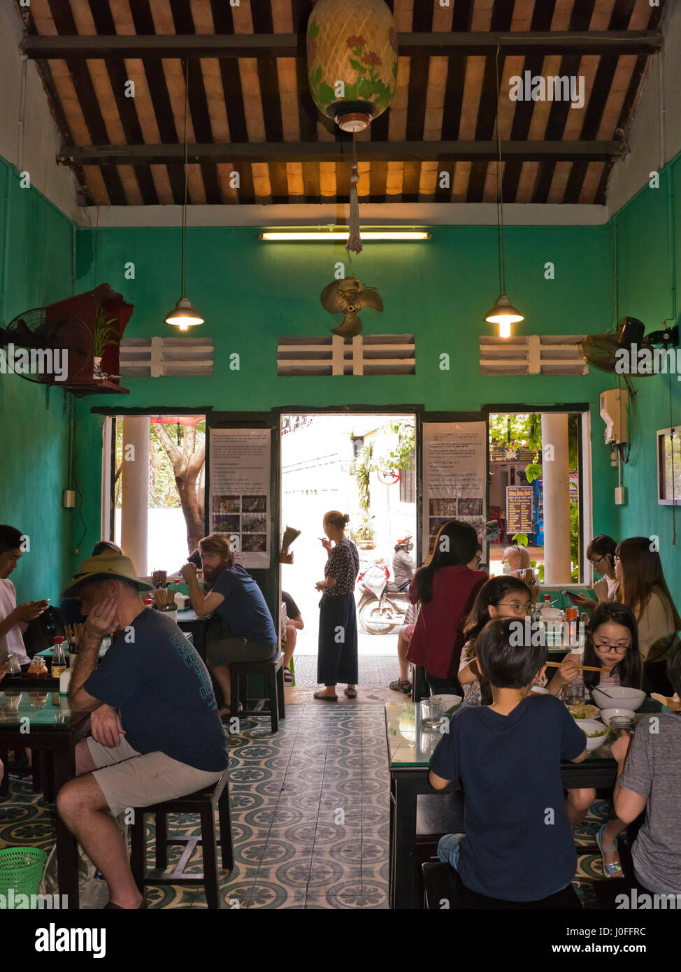 Vertical view inside a traditional Vietnamese restaurant in Hoi An ...