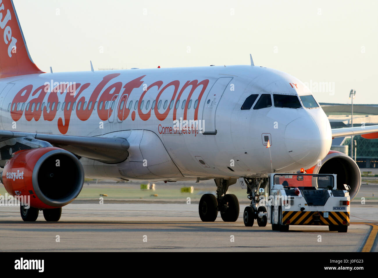 G-EZIY,Easyjet Airbus 319 is pushed back from stand, Barcelona, Spain ...