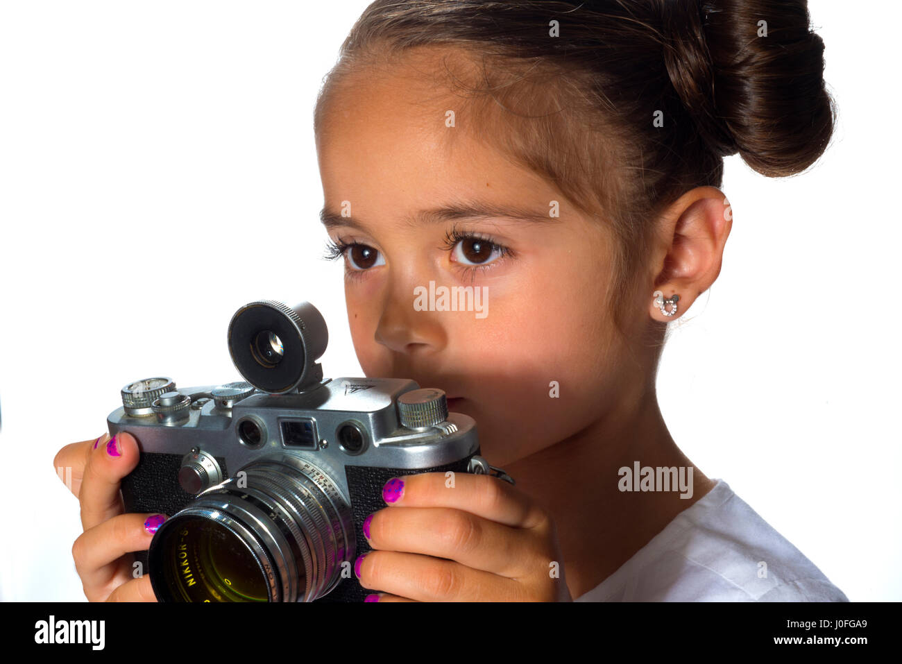 young girl modeling in studio with range finder camera Stock Photo - Alamy